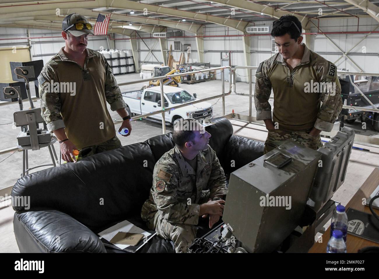 Staff Sgt. Marc “Coop” Cooperman (center), an explosive ordnance ...