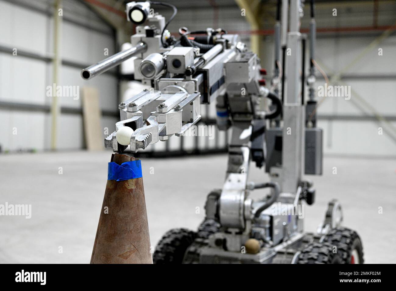 A remotely controlled Andros F6 robot is positioned to drop a ping pong ...