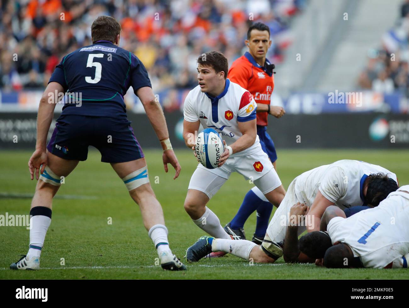 Antoine Dupont of France looks to pass the ball clear from a ruck ...