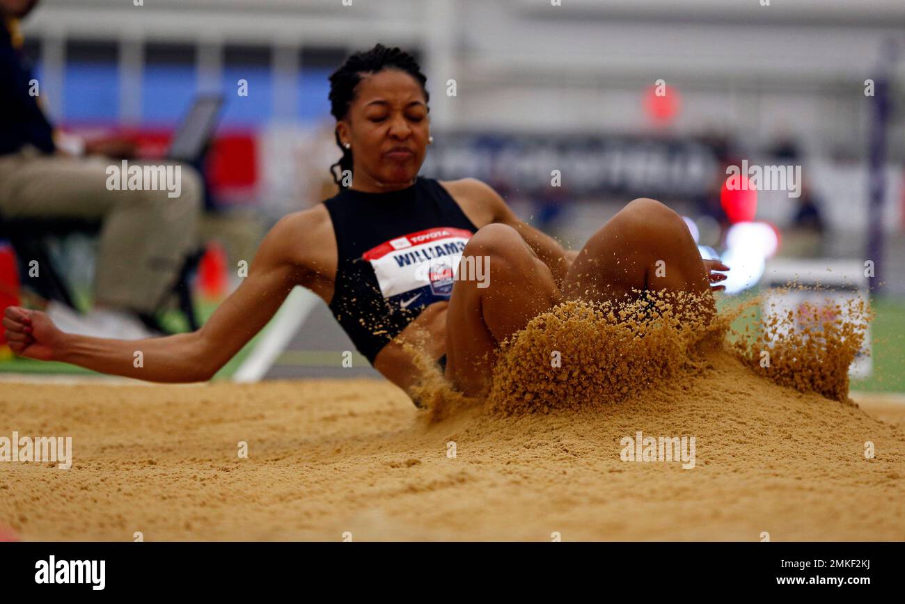 Kendell Williams competes in the long jump part of the pentathlon ...