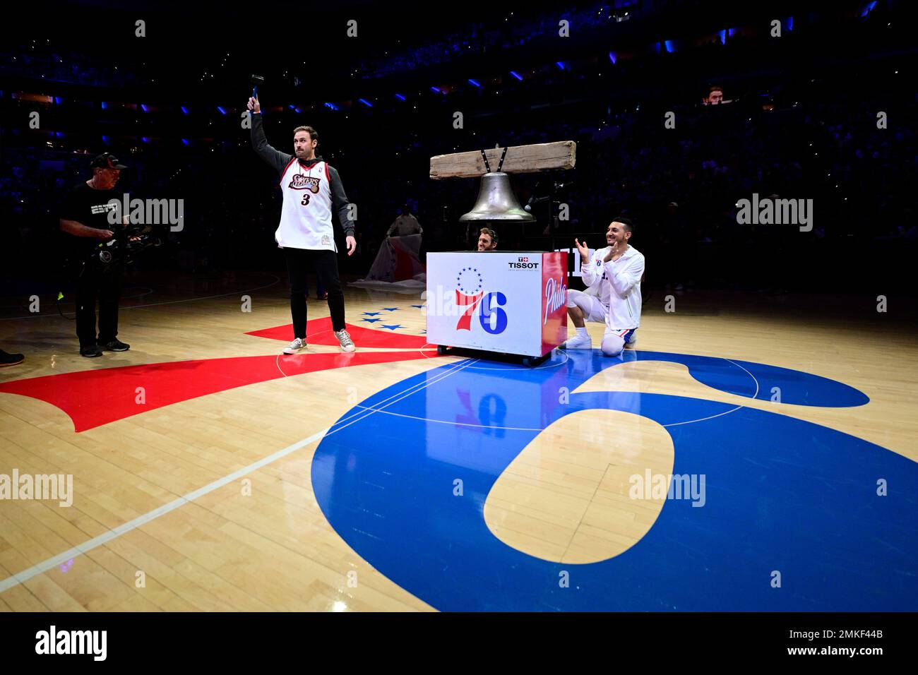 Former NFL player Chris Long rings the bell prior to an NBA basketball ...
