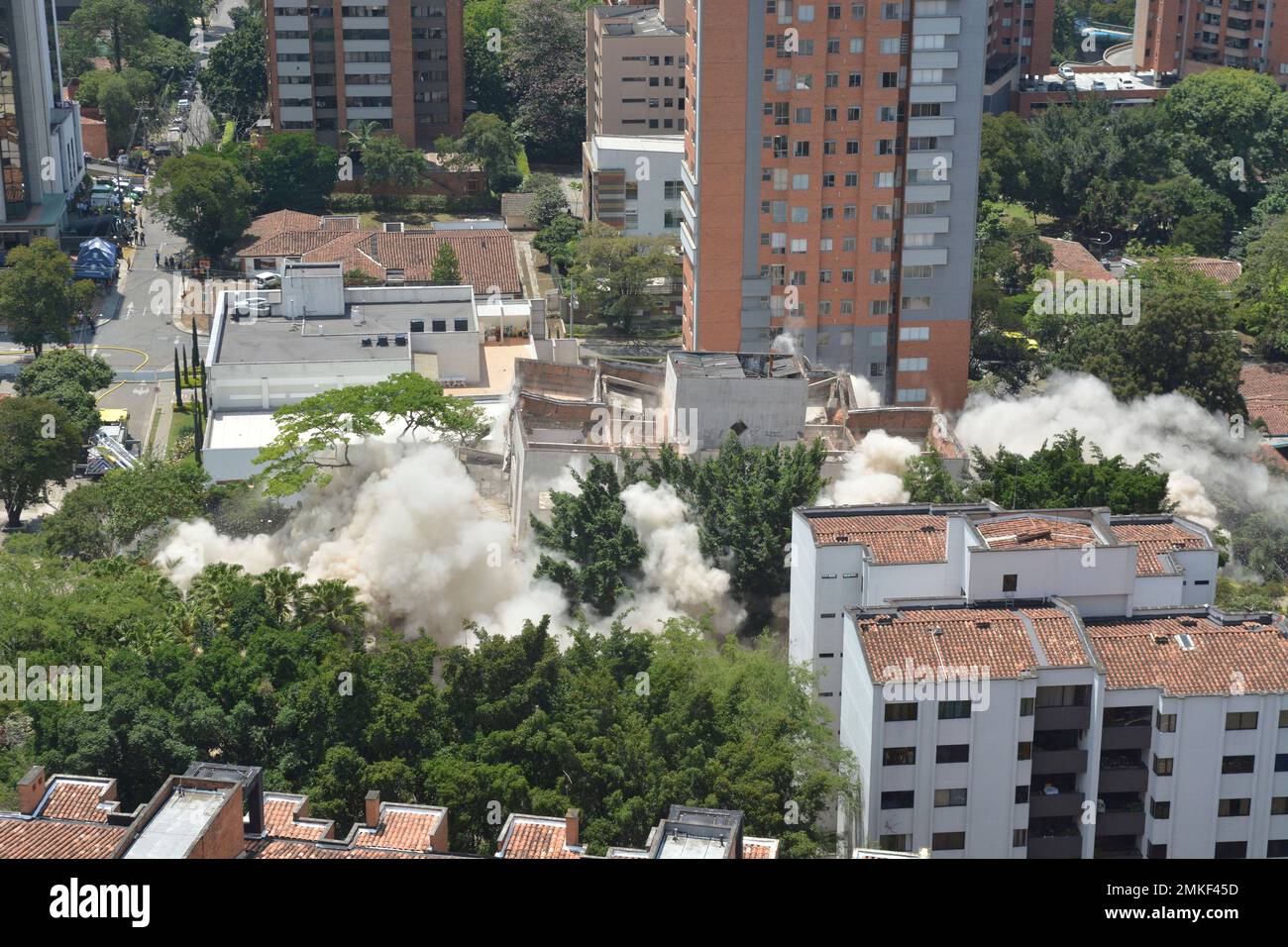 Clouds of dust rise during the implosion of a six-floor apartment ...