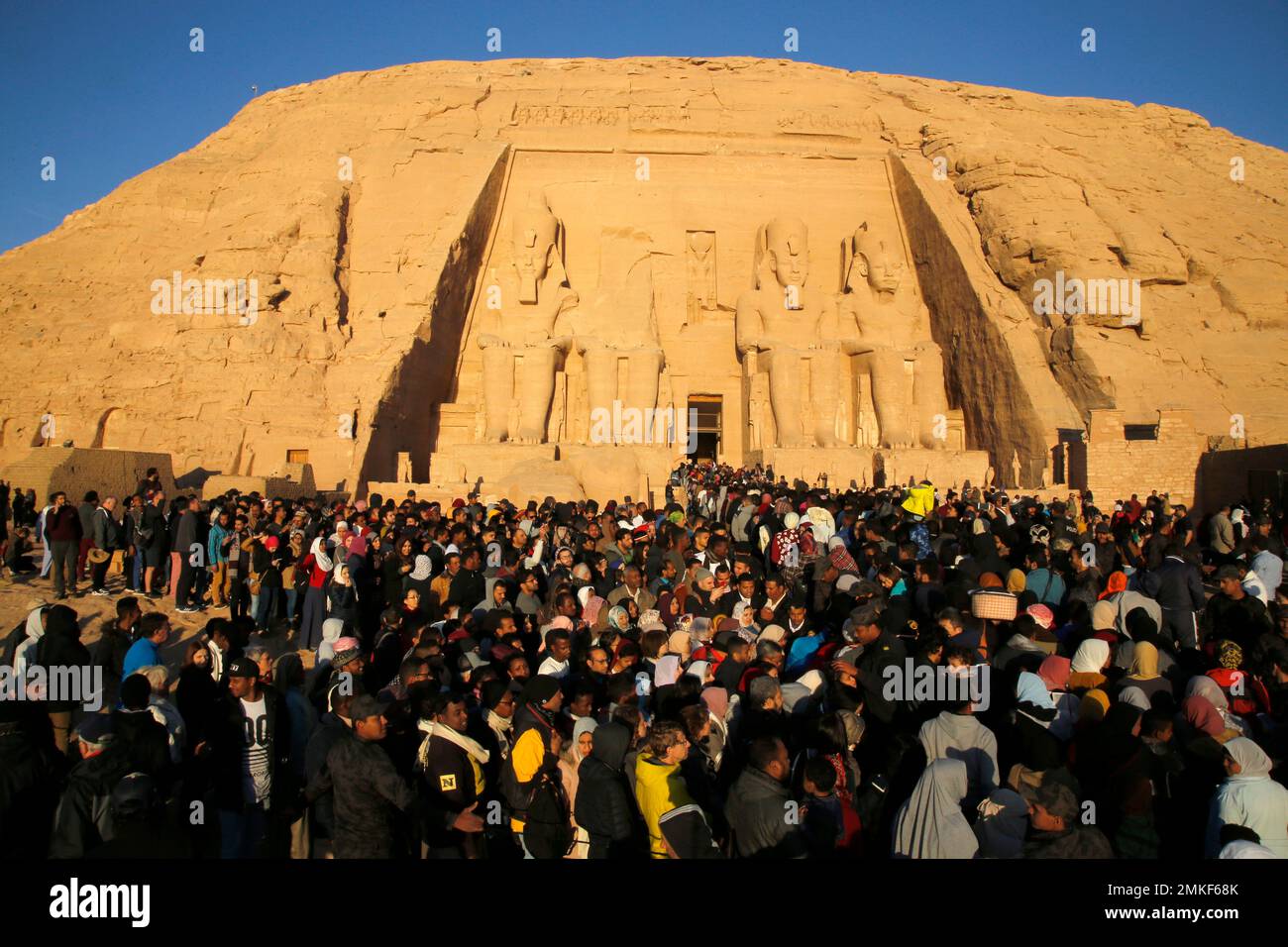 Thousands of visitors line up to visit the Great Temple of Ramses II ...