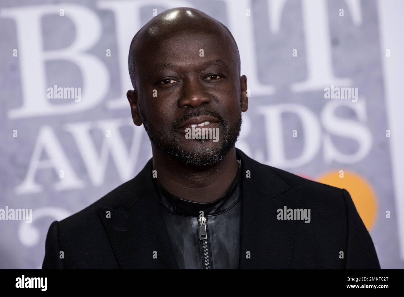 Sir David Adjaye poses for photographers upon arrival at the Brit ...