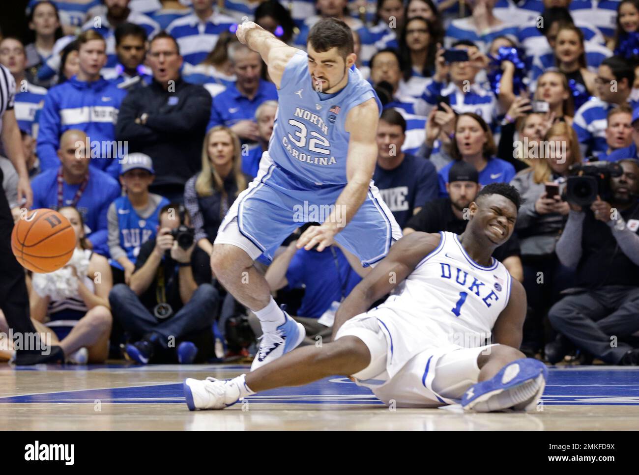 Duke's Zion Williamson (1) falls to the floor with an injury while ...