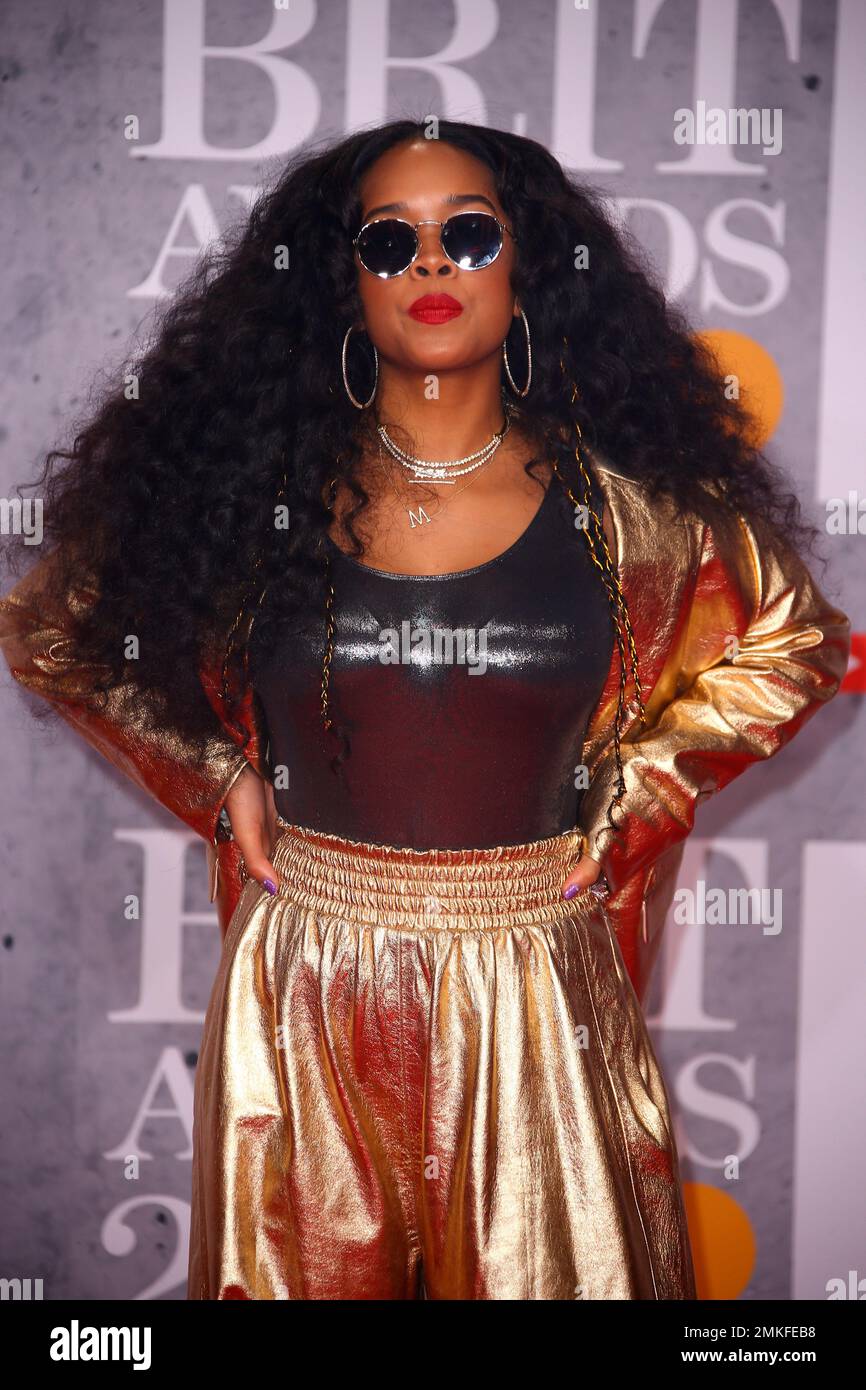 Singer Gabi Wilson, or H.E.R. poses for photographers upon arrival at ...