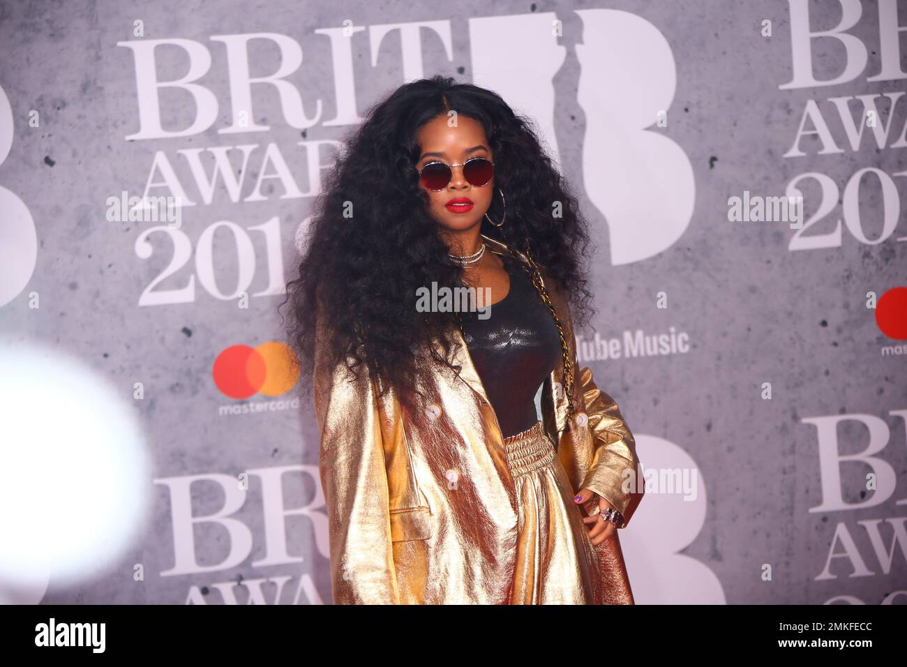 Singer Gabi Wilson, or H.E.R. poses for photographers upon arrival at ...