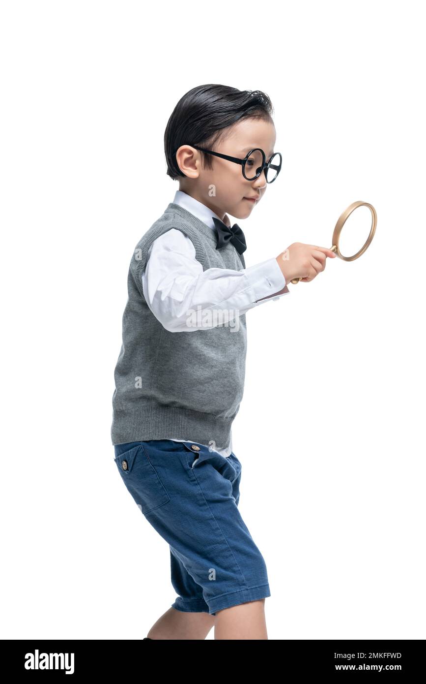 The little boy with a magnifying glass Stock Photo - Alamy