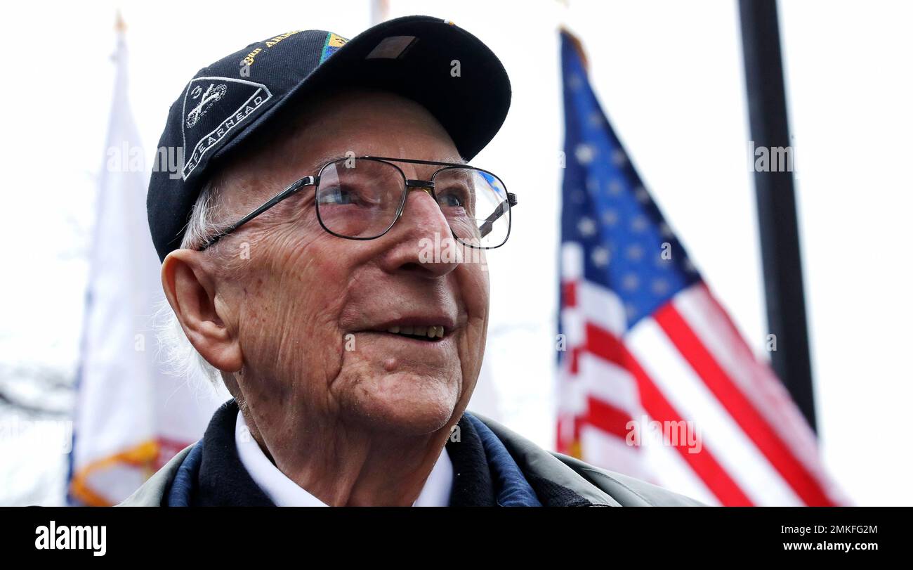 World War II tank gunner Clarence Smoyer smiles as he admires a tank ...