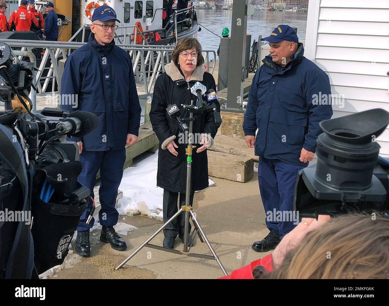 U.S. Sen. Susan Collins, R-Maine, is flanked by Coast Guard Capt. Brian ...
