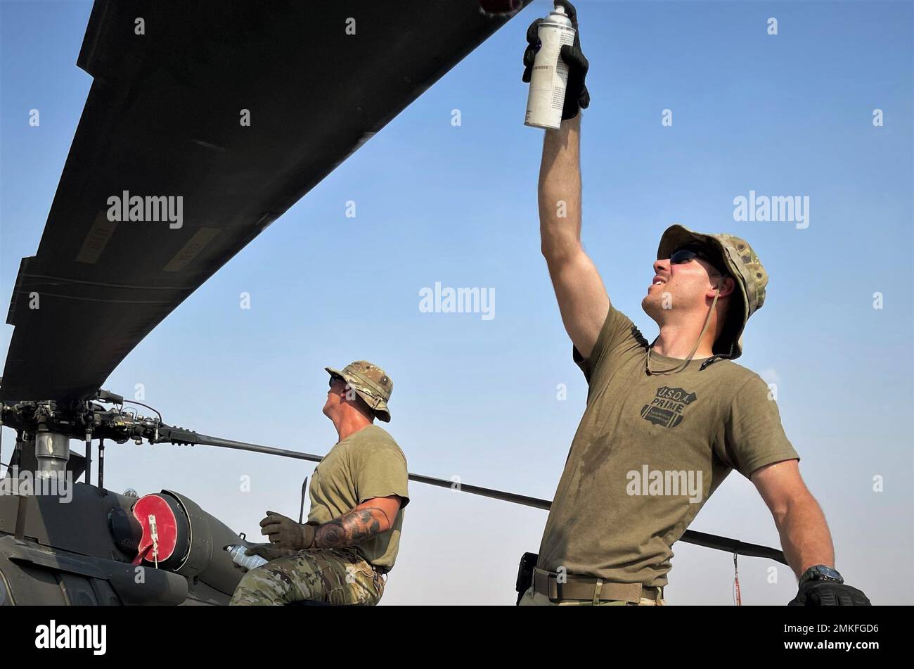 U.S. Army Sgt. Mirza Dzinic and Sgt. Dillon Tonne, crew chiefs for ...