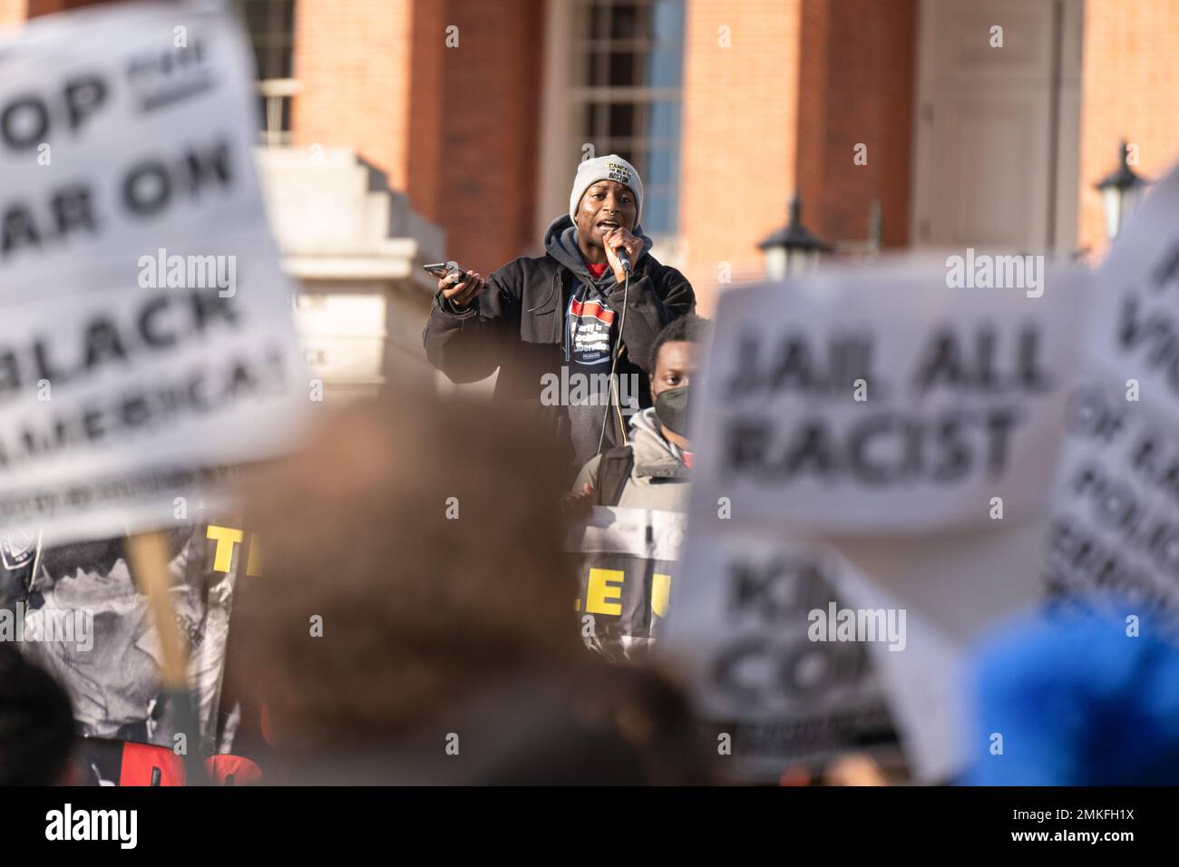 Boston, United States. 28th Jan, 2023. A community activist addresses ...