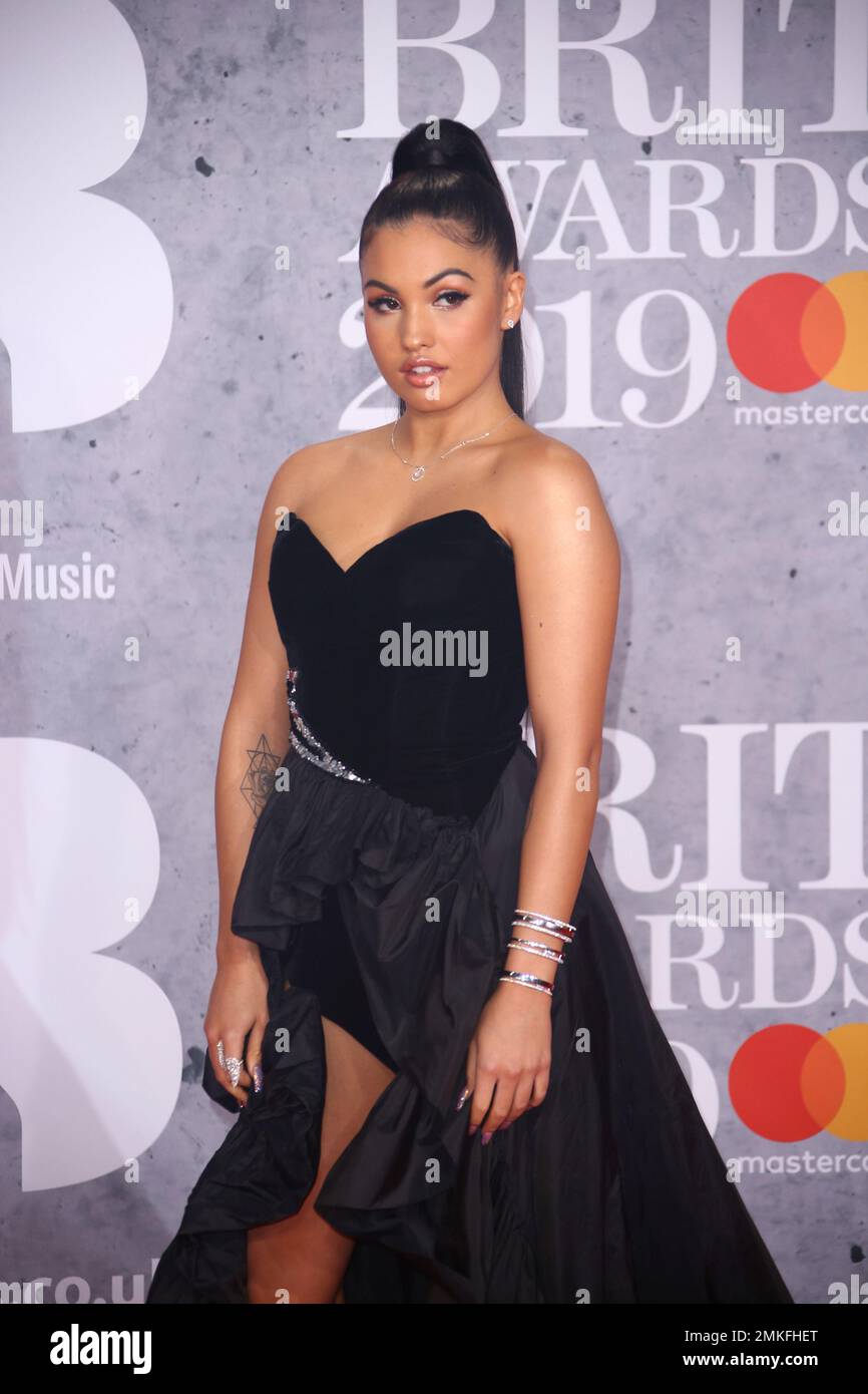 Singer Mabel McVey poses for photographers upon arrival at the Brit ...