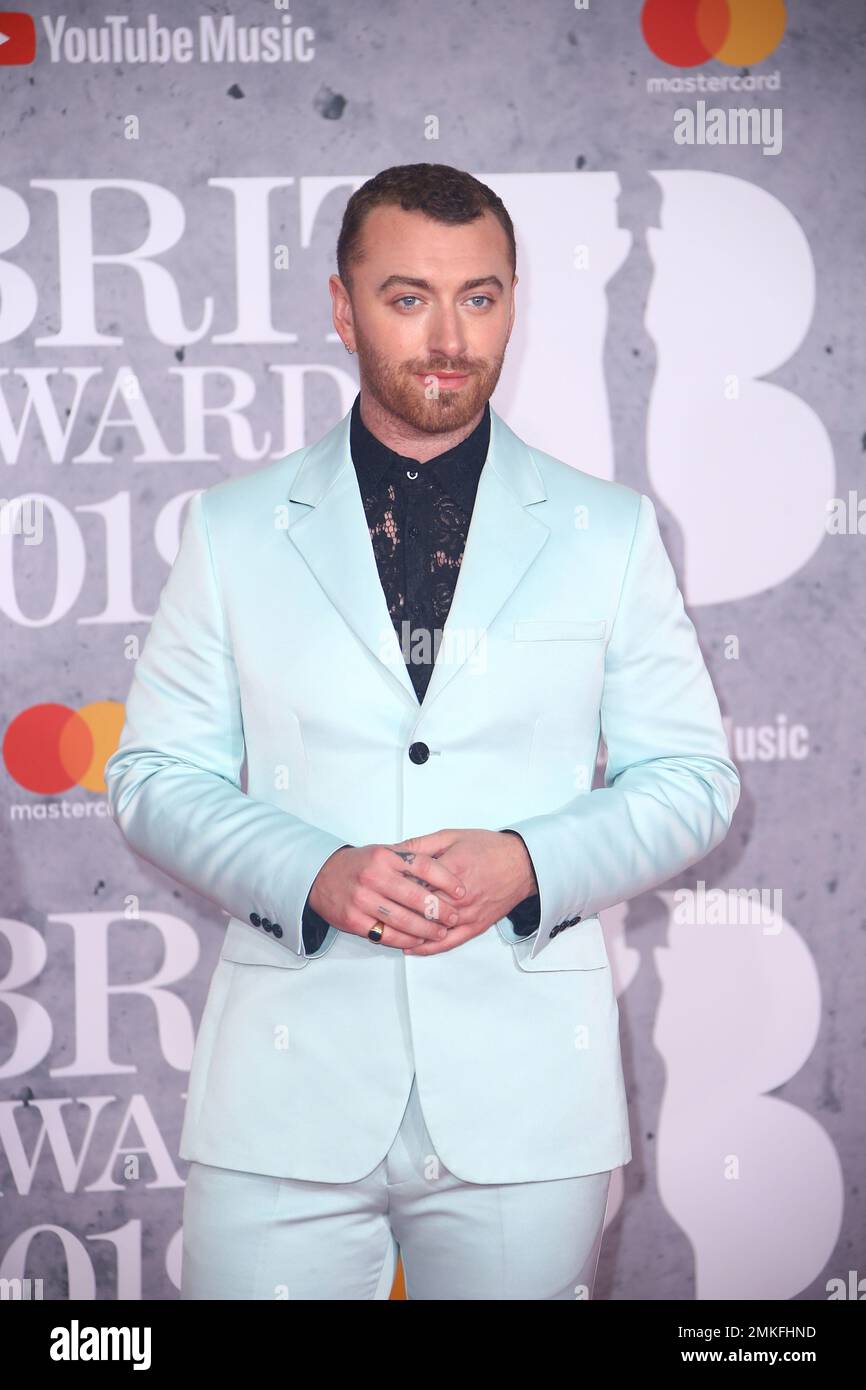 Singer Sam Smith poses for photographers upon arrival at the Brit ...