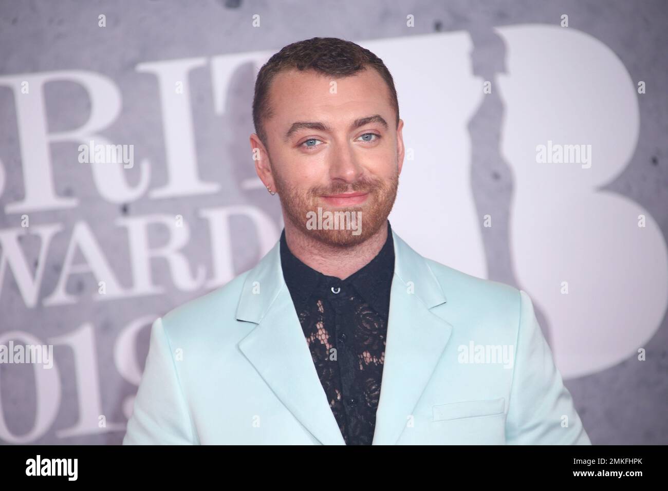 Singer Sam Smith poses for photographers upon arrival at the Brit ...