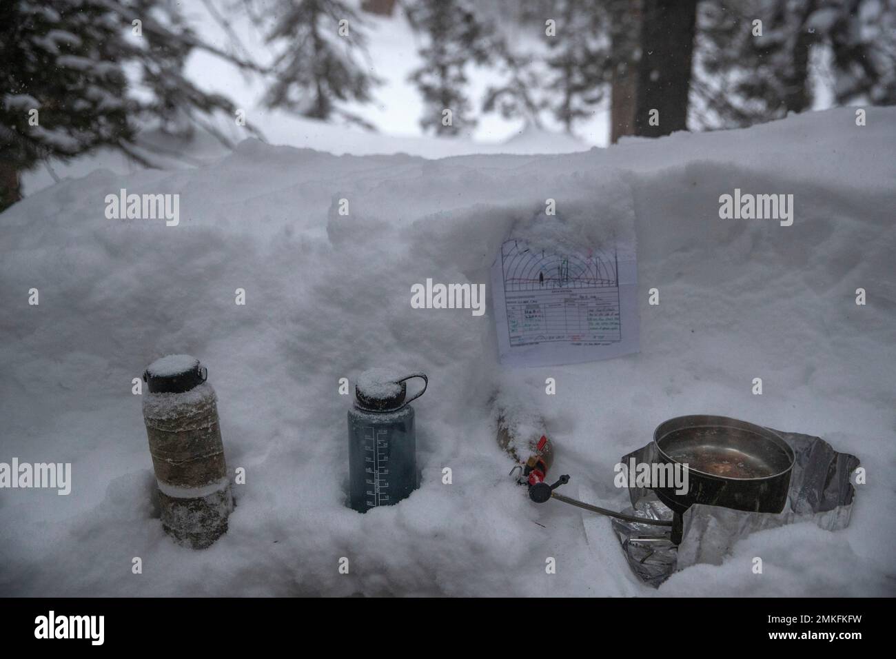 U.S. Marines boils water in a trench during advanced cold-weather ...