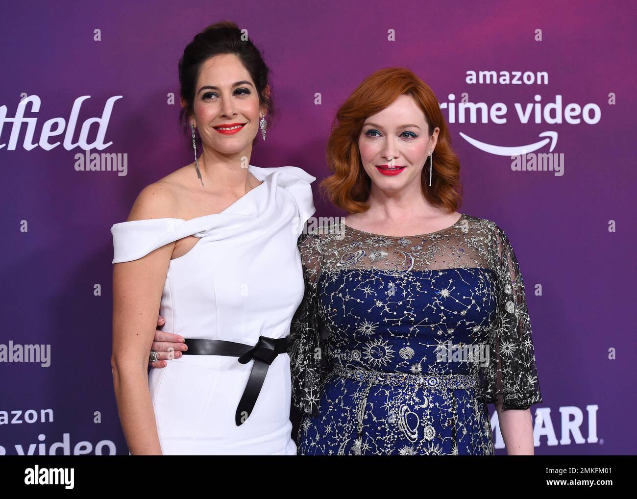 Erin Benach, left, and Christina Hendricks arrive at the 21st annual ...