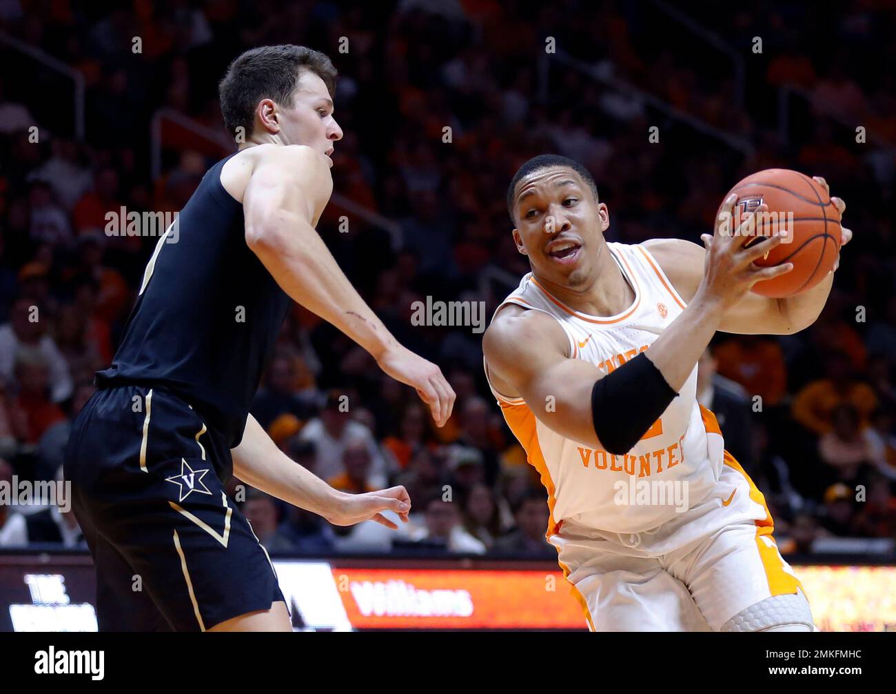 Tennessee forward Grant Williams (2) drives past Vanderbilt forward ...