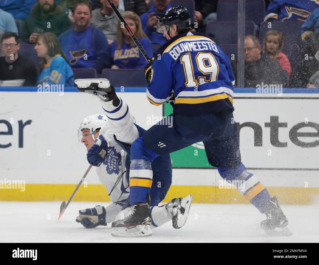 St. Louis Blues' Jay Bouwmeester (19) sends Toronto Maple Leafs' Zach ...