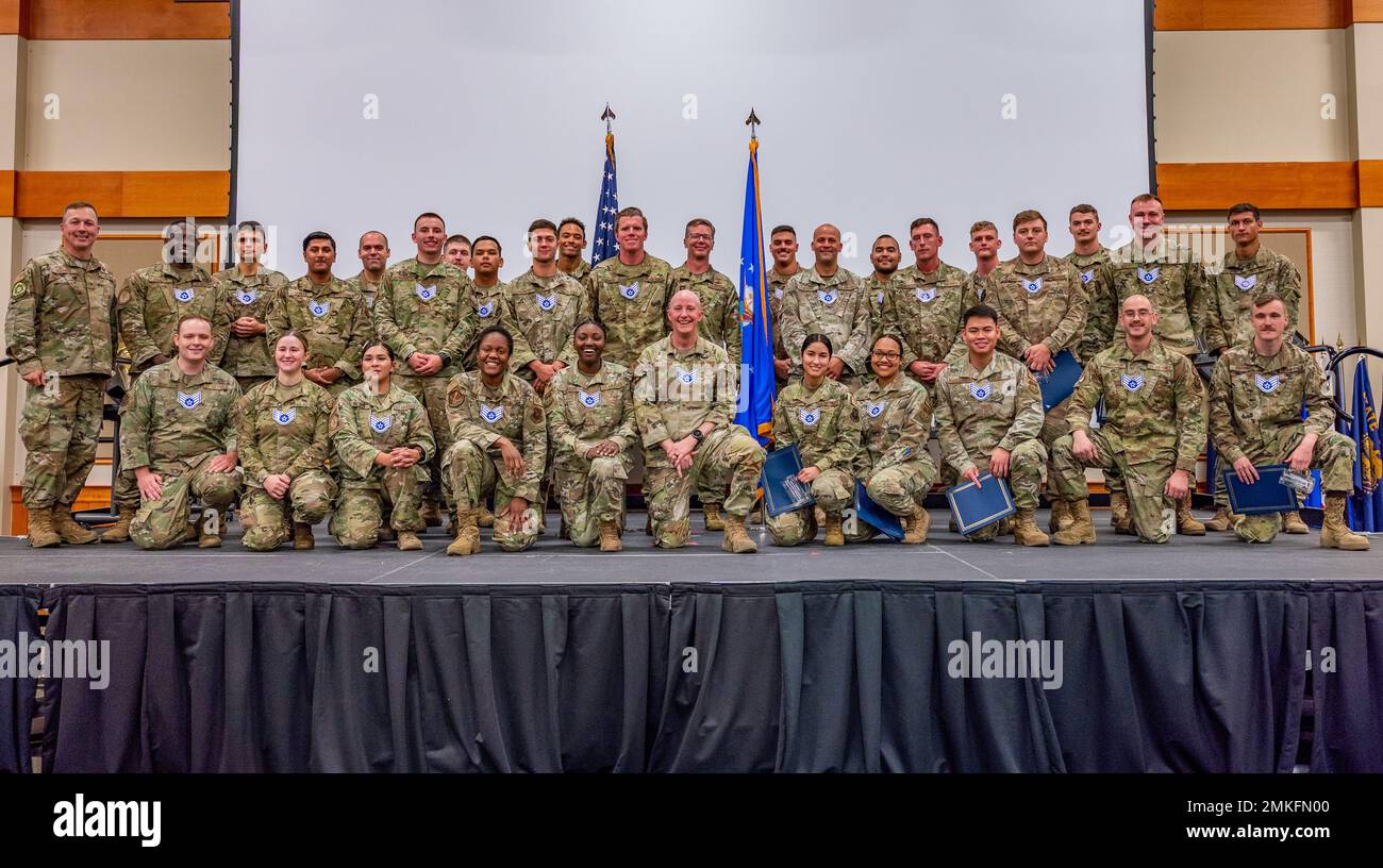 A group of senior airmen pose for a picture during a staff sergeant ...