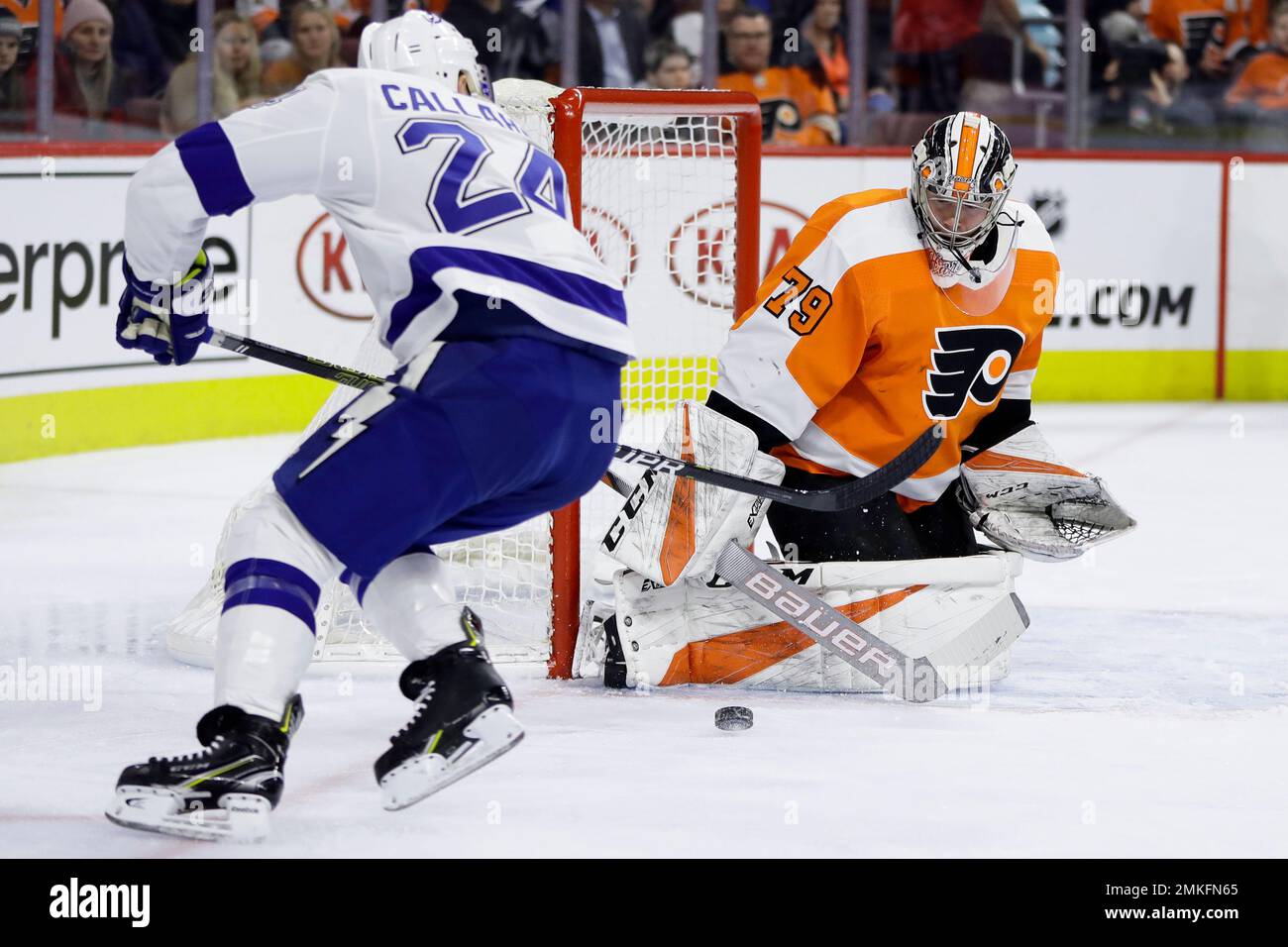 Philadelphia Flyers' Carter Hart, right, blocks a shot by Tampa Bay ...