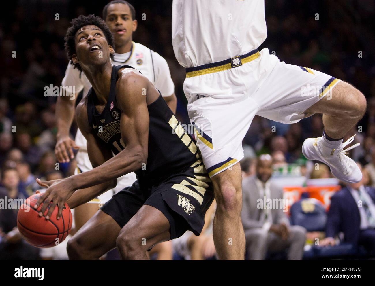Wake Forest's Jaylen Hoard, left, looks for a shot next to Notre Dame's ...