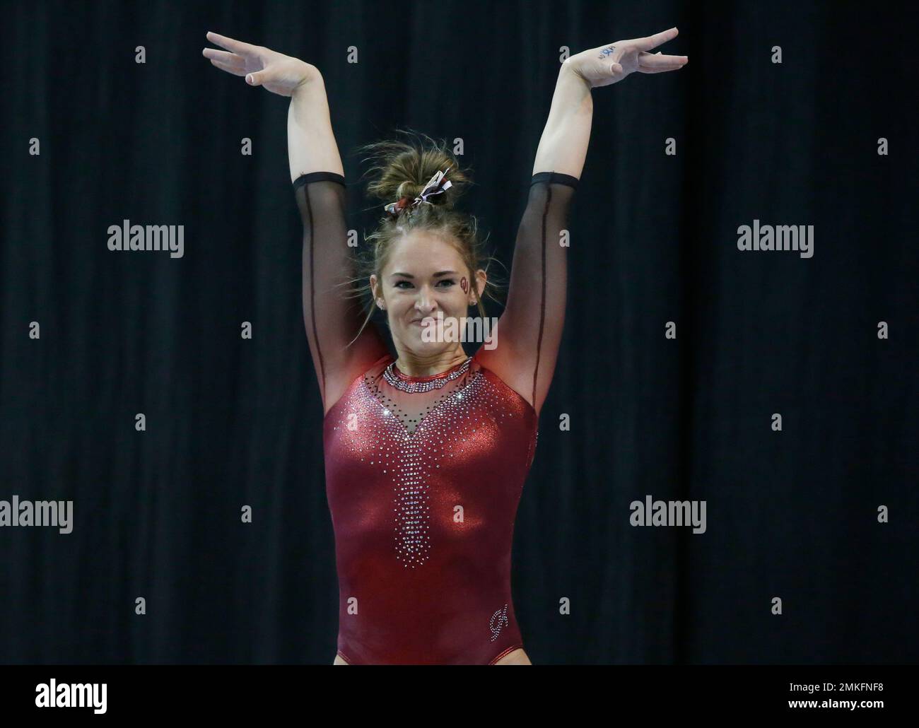 Oklahoma gymnast Carly Woodard creacts after competing on the balance ...