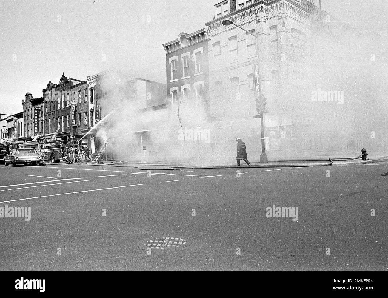Firemen battle a burning building, April 5, 1968, as looting and arson ...