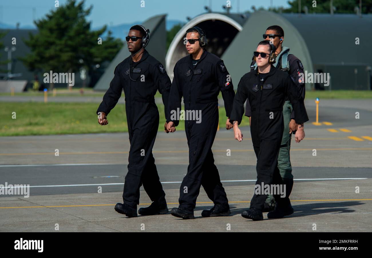 Members of the Pacific Air Forces (PACAF) F-16 Demonstration Team march ...