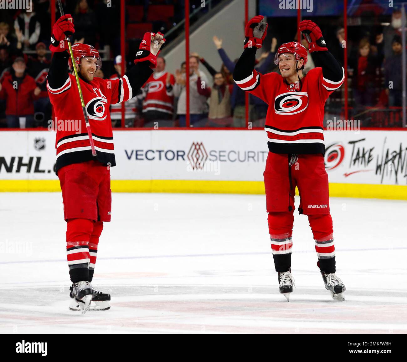 Carolina Hurricanes' Jaccob Slavin, left, and Brett Pesce, right, start ...