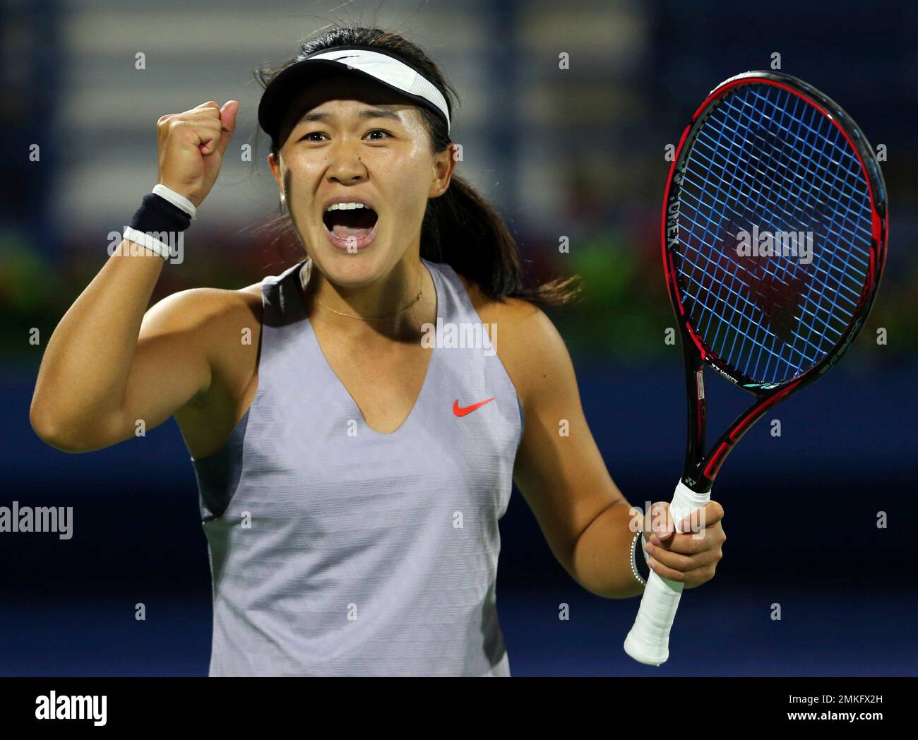 China's Zhu Lin celebrates after she defeated Belgium's Elise Mertens ...