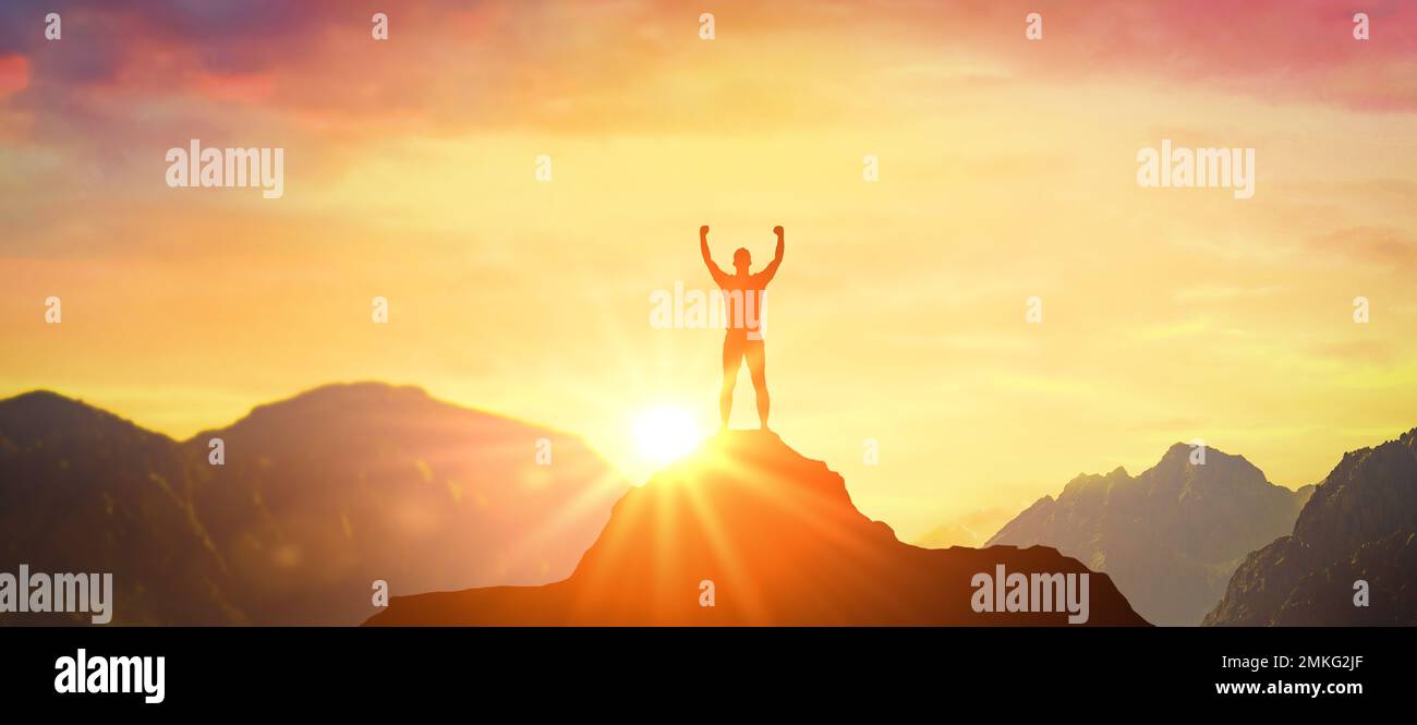Success. successful man with hands up on peak of mountain at sunset ...