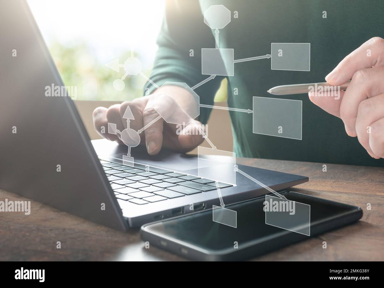 businessman using laptop develops an interaction block diagram of ... businessman using laptop develops an interaction block diagram of ...