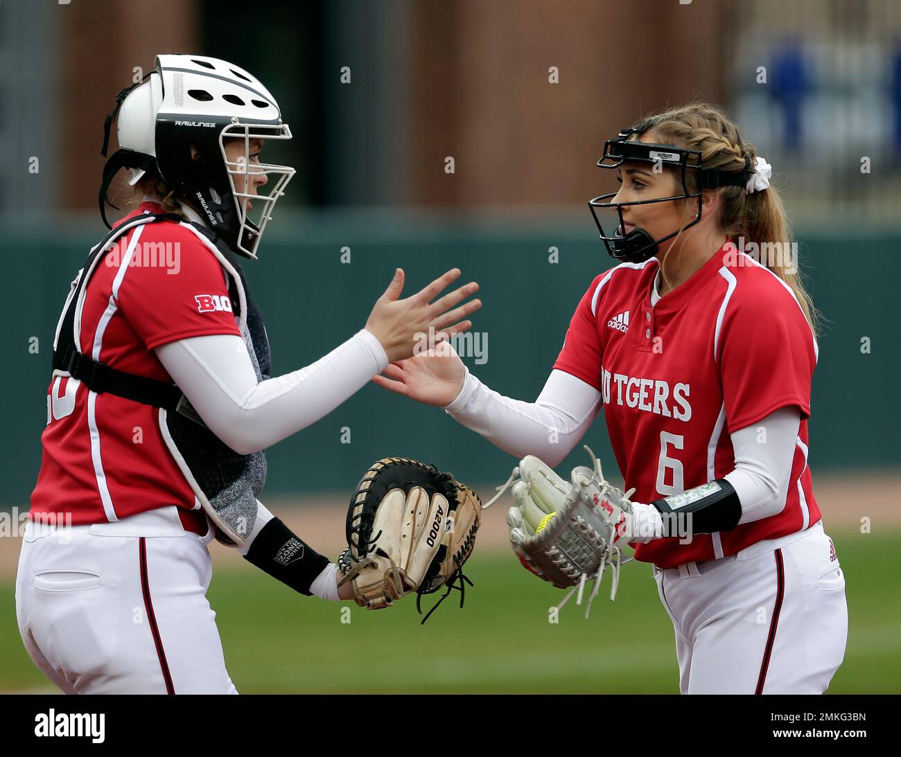 Rutgers' catcher Katie Wingert, left, and pitcher Cambria Keefer high ...
