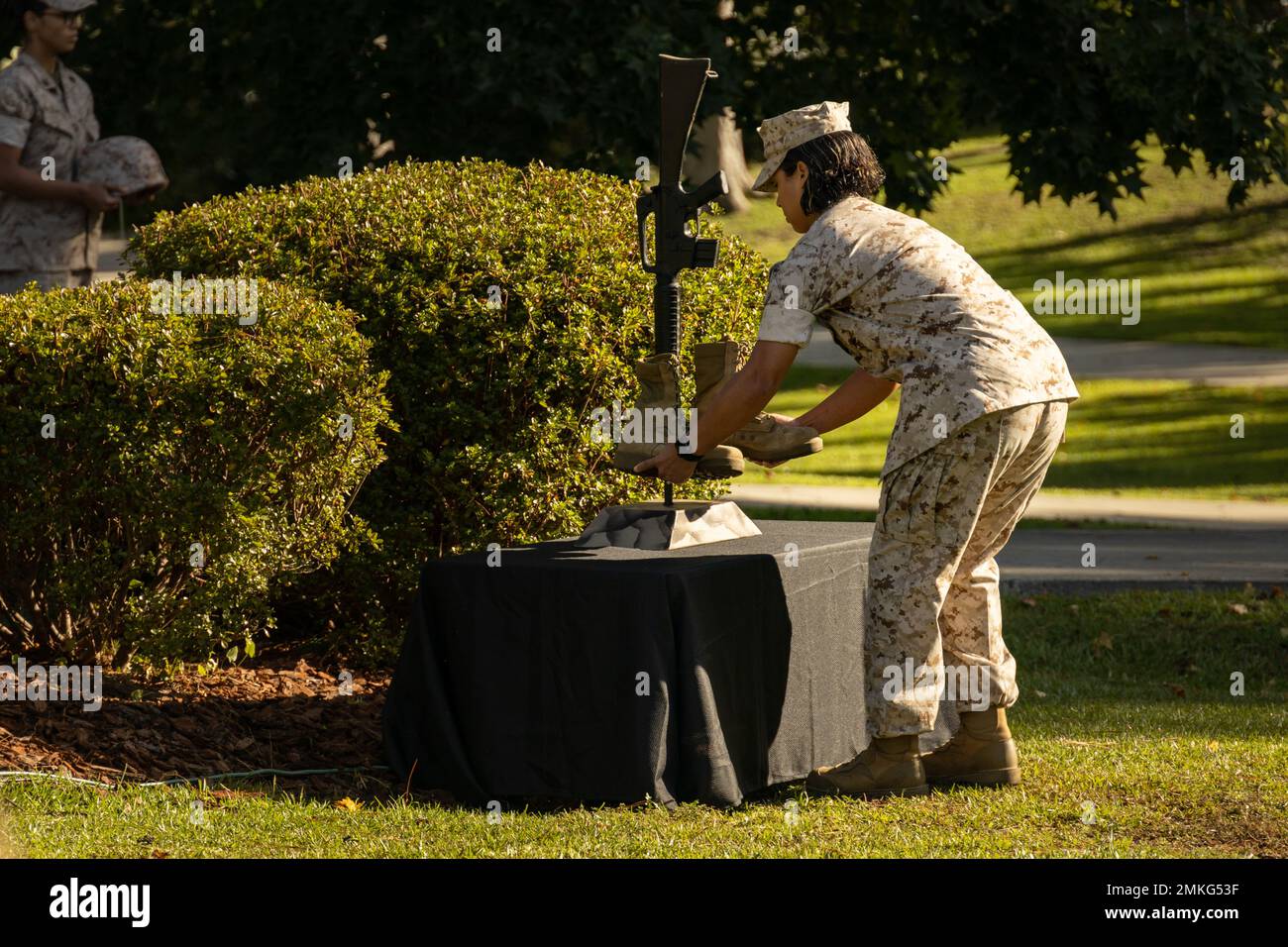 A U.S. Marine assembles a battle cross during the Patriot Day ...