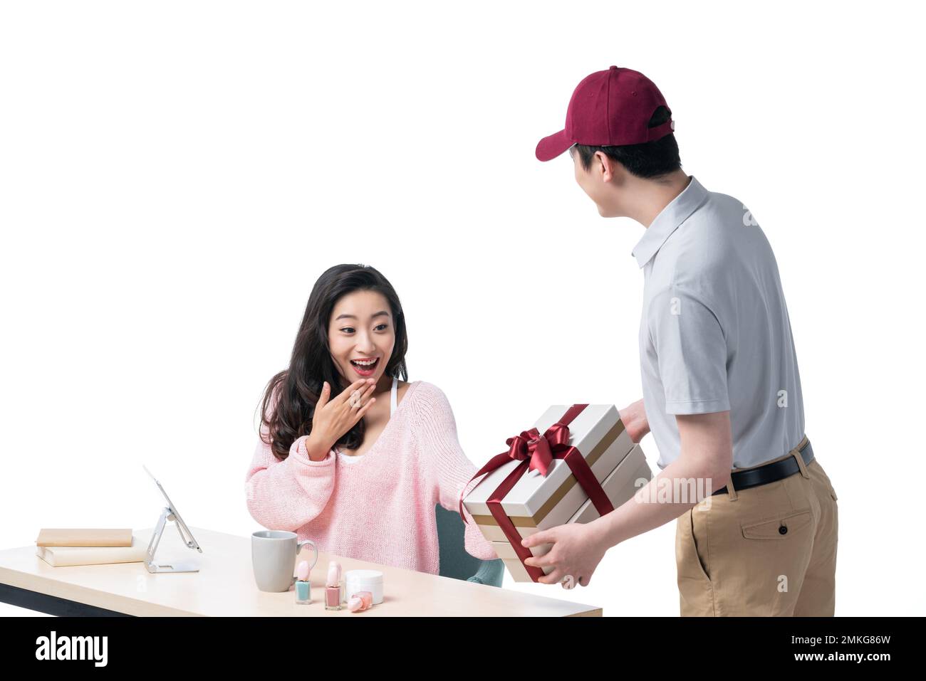Young woman to sign for a gift Stock Photo - Alamy