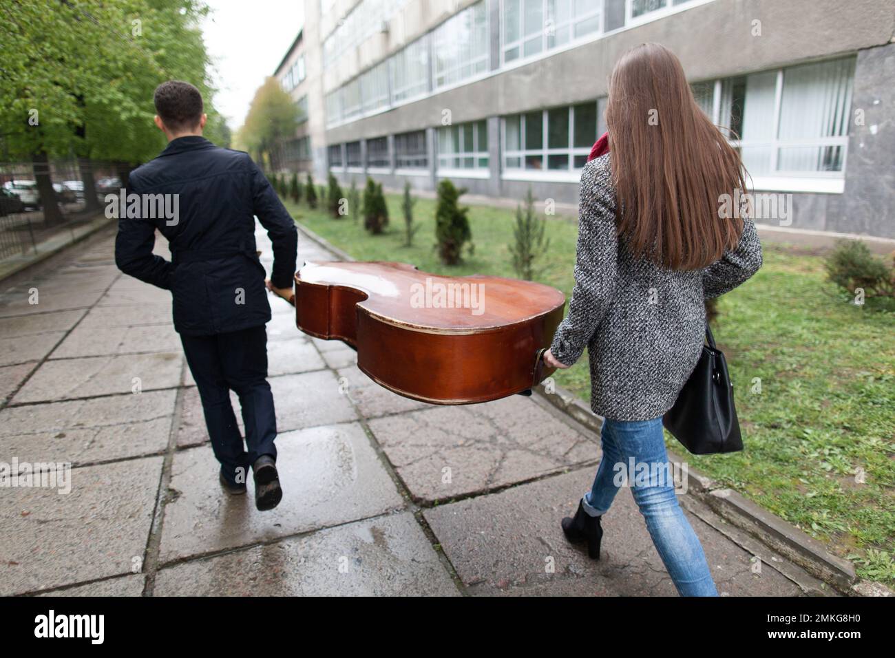 Man carrying double bass musical instrument hi-res stock photography ...