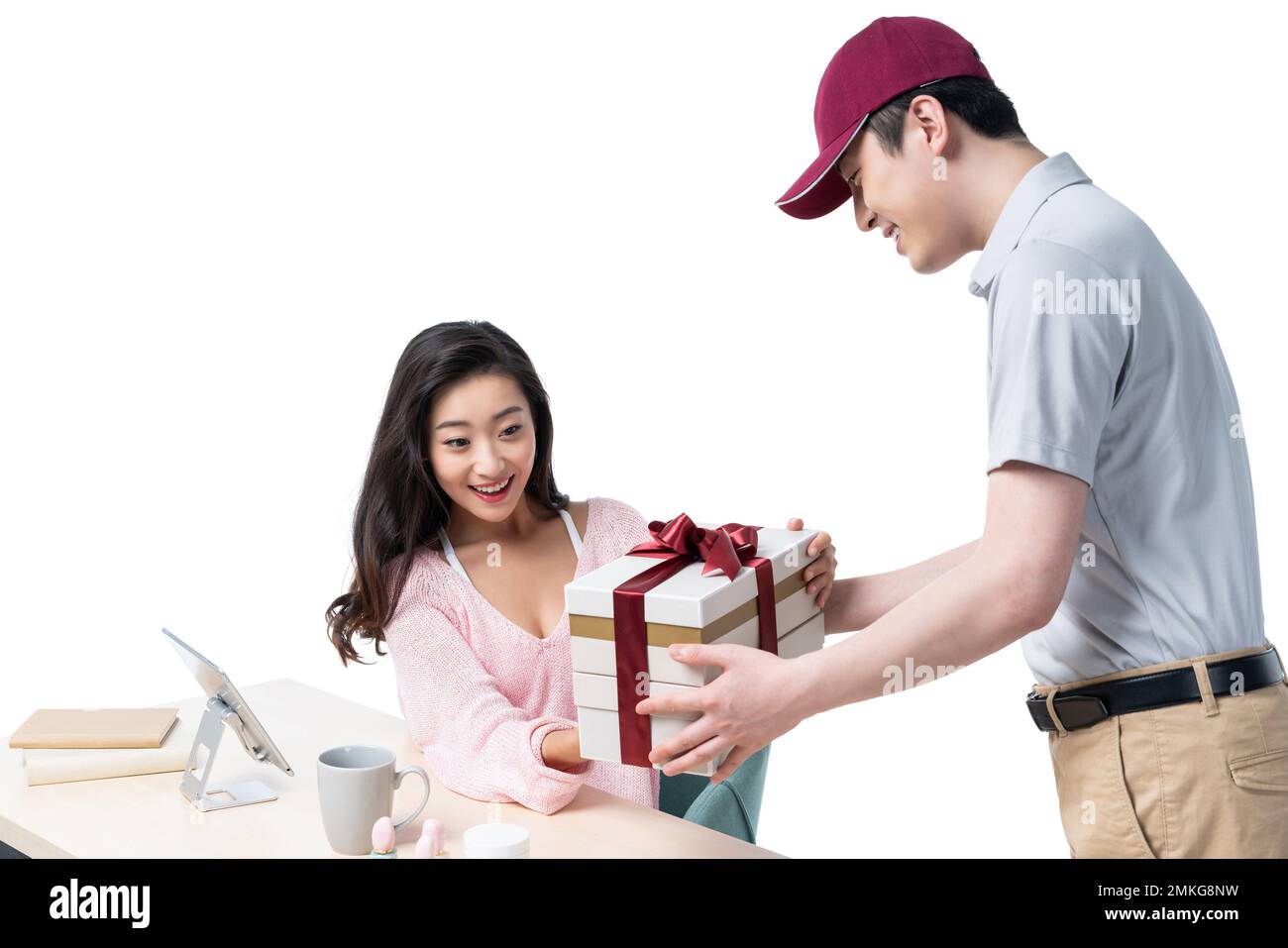 Young woman to sign for a gift Stock Photo - Alamy