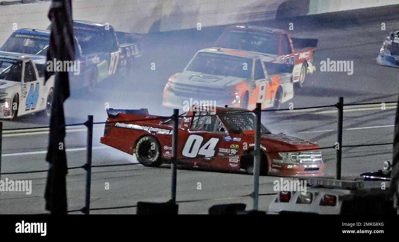Cory Roper (04) spins during the NASCAR Truck Series auto race Friday ...
