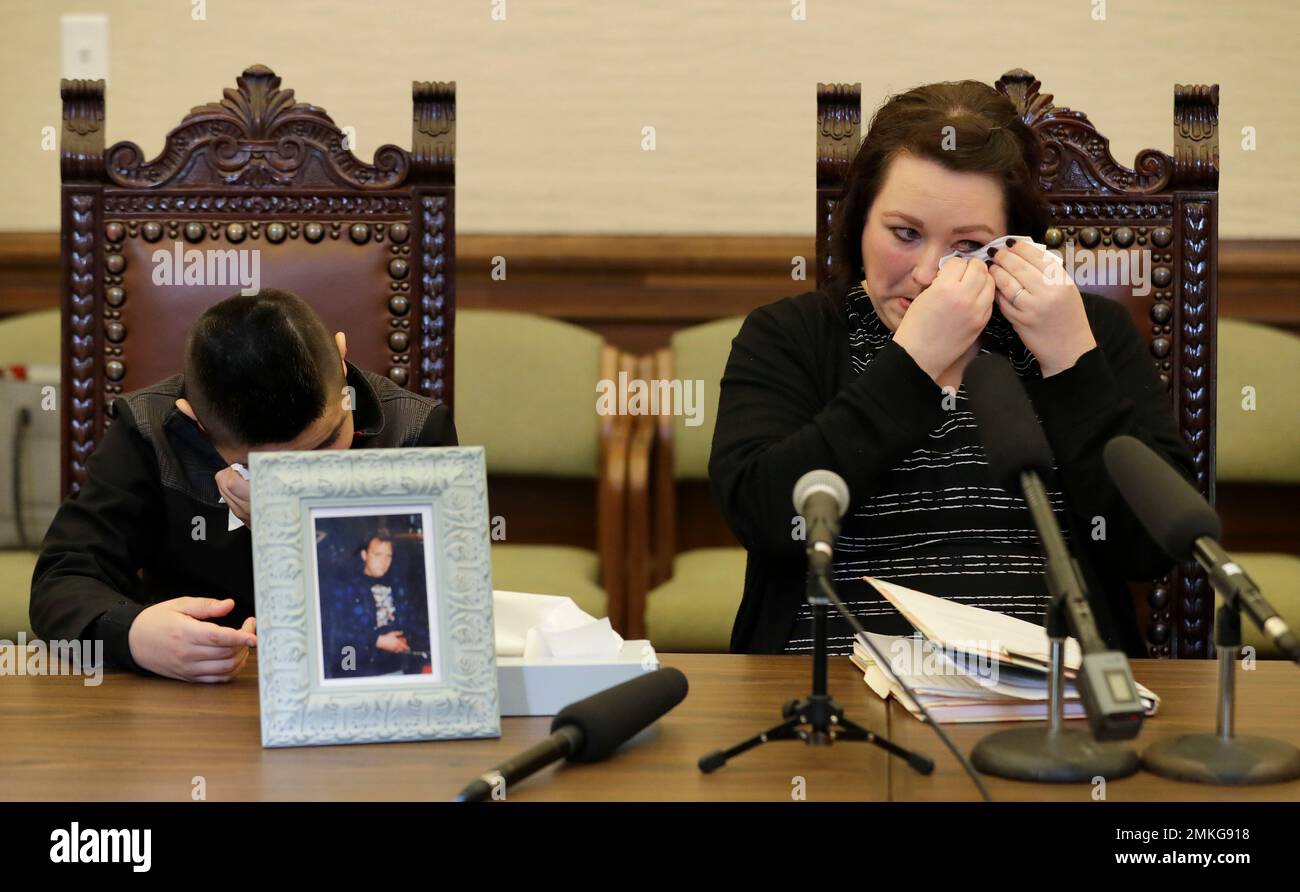 Freedom Nitschke, right, and her son, Julian Martinez, 11, wipe away ...