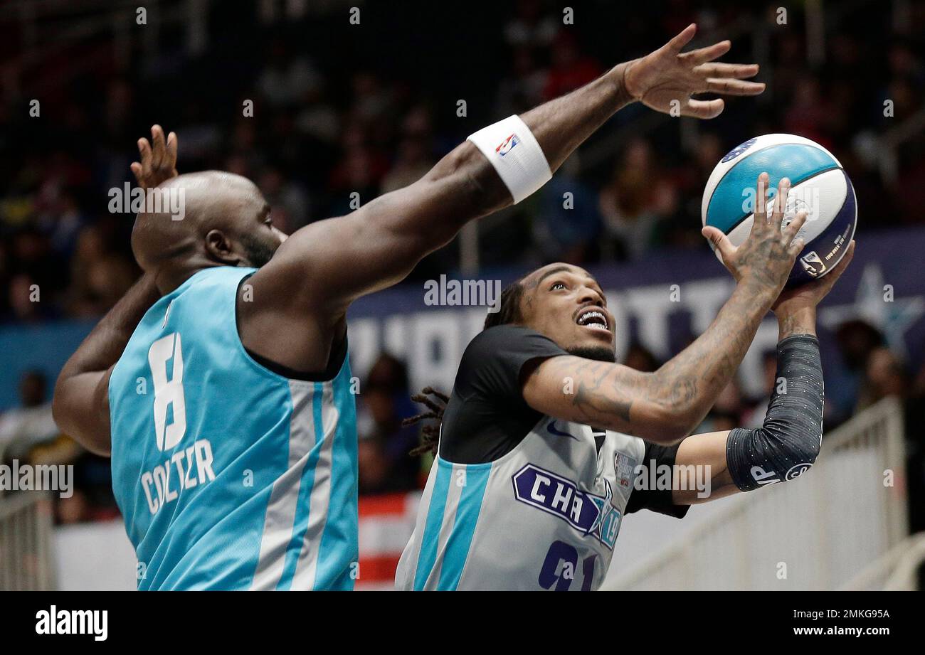 Home team's Mike Colter (8) defends while Away team's Quavo (91) drives ...