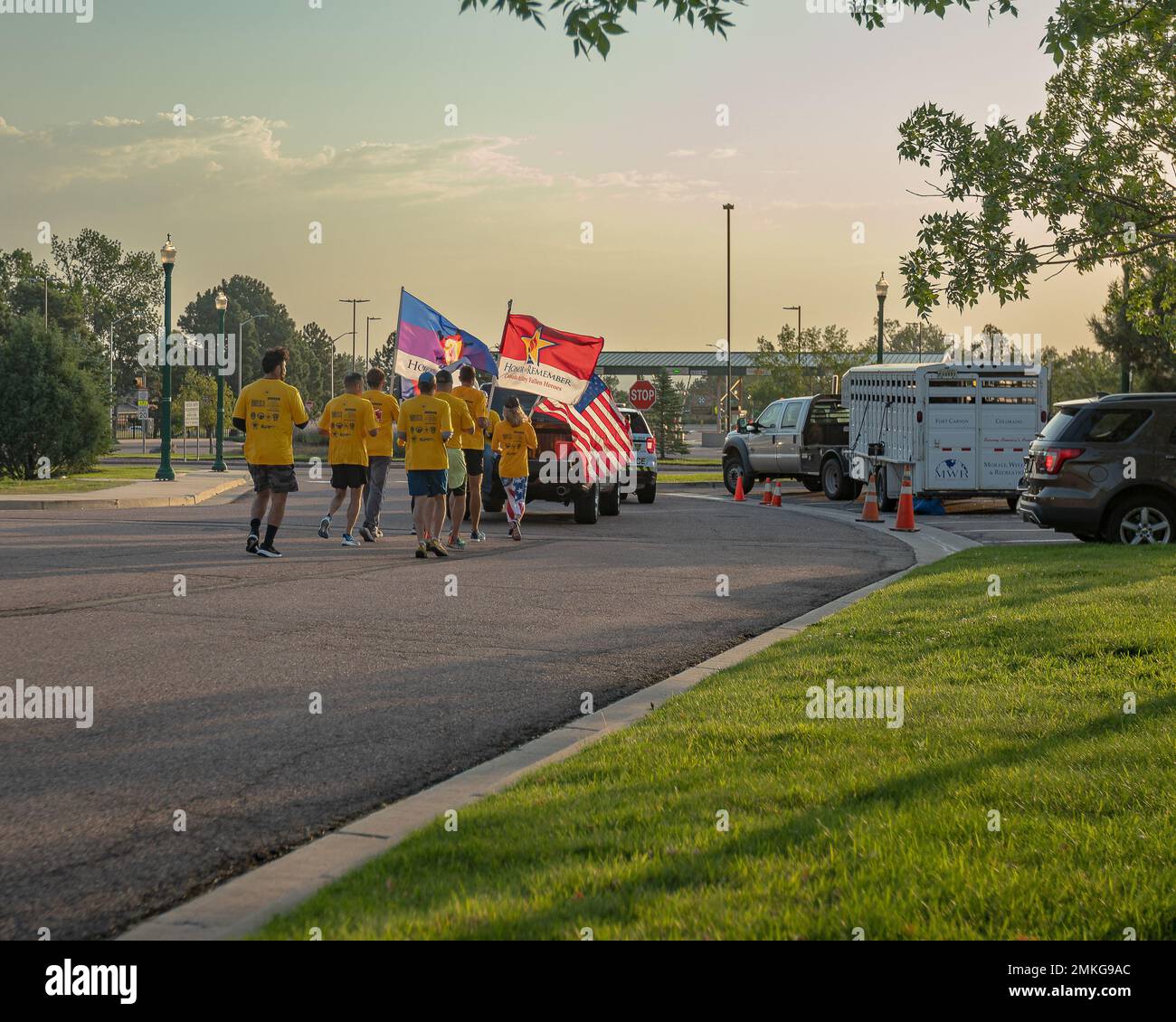 Volunteer runners with the 4th Annual Colorado Run for the Fallen begin ...