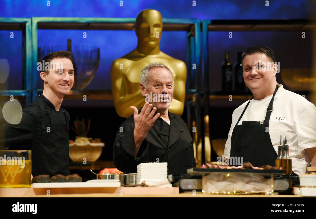 Chef Wolfgang Puck, center, is flanked by his son Byron, left, and Eric ...