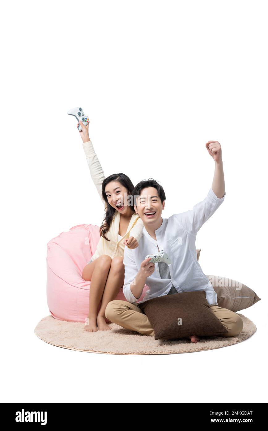 Young couple together playing computer games Stock Photo - Alamy