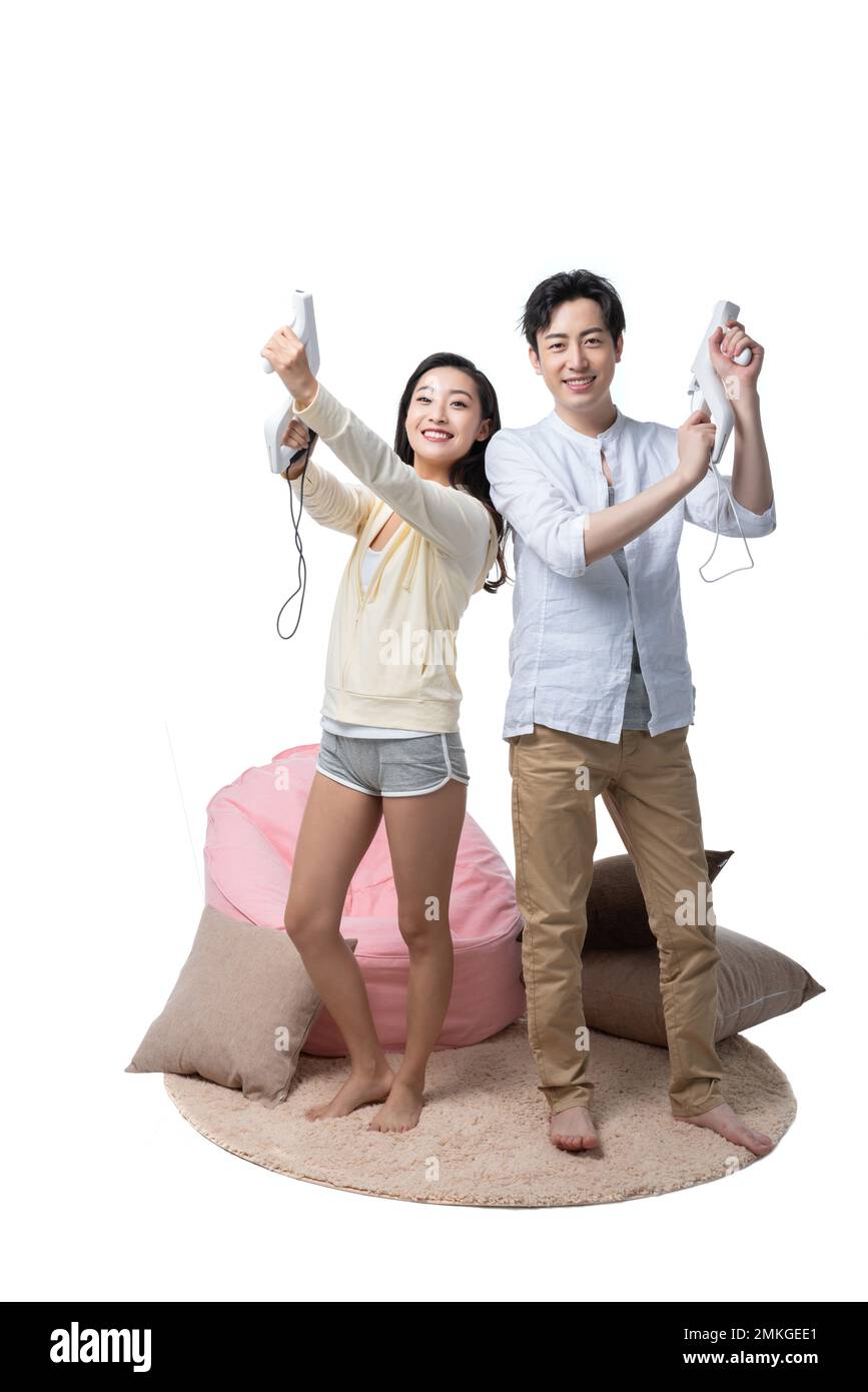 Young couple together playing computer games Stock Photo - Alamy