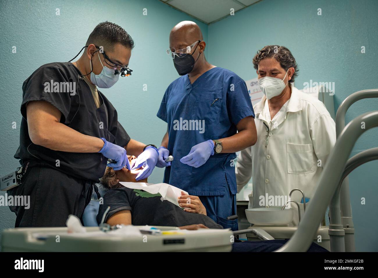 U.S. Air Force Maj. Rondre Baluyot, left, a Dentist assigned to 5th ...