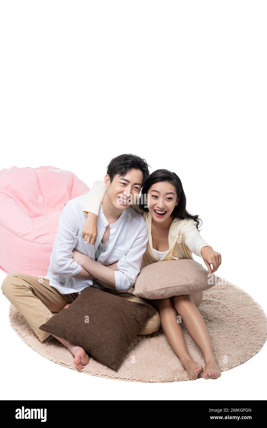 The young couple watching movies at home Stock Photo - Alamy