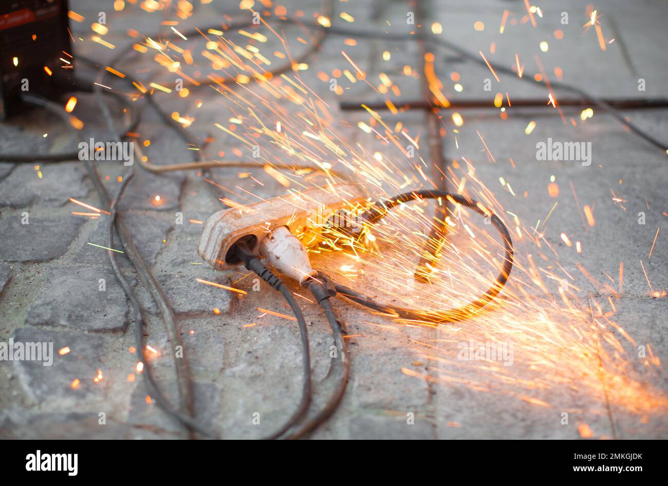 burning spark electrical outlet shorting, danger Stock Photo - Alamy