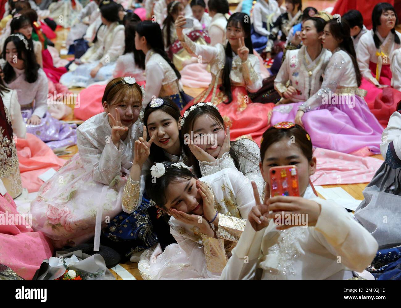 South Korean seniors clad in traditional attire take a souvenir photo ...