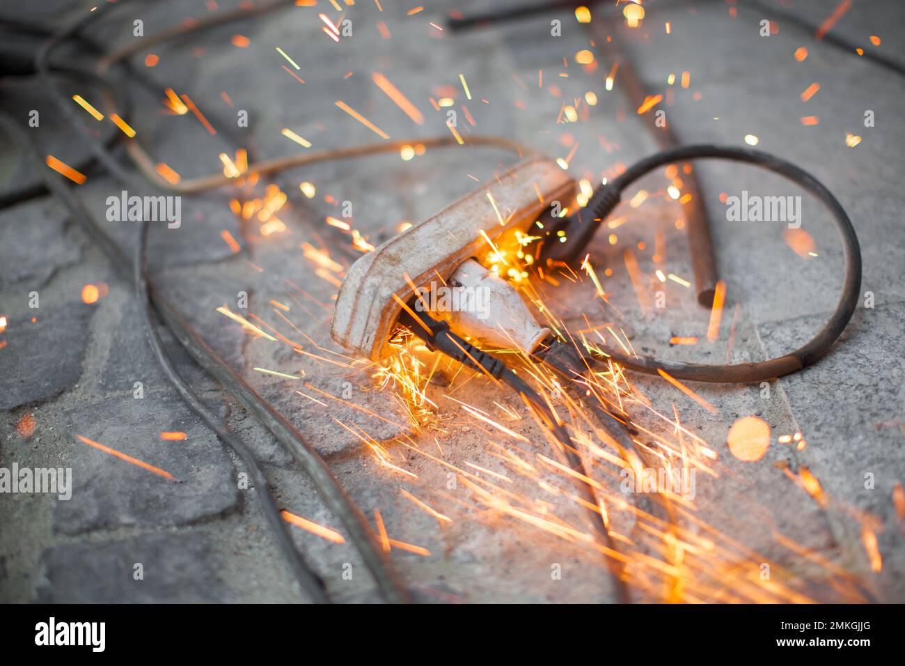 burning spark electrical outlet shorting, danger Stock Photo - Alamy